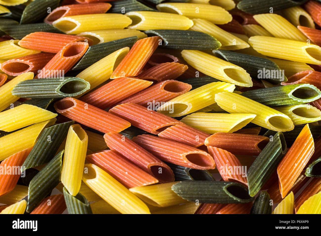 Macaroni tricolor with organic pasta integral Stock Photo - Alamy