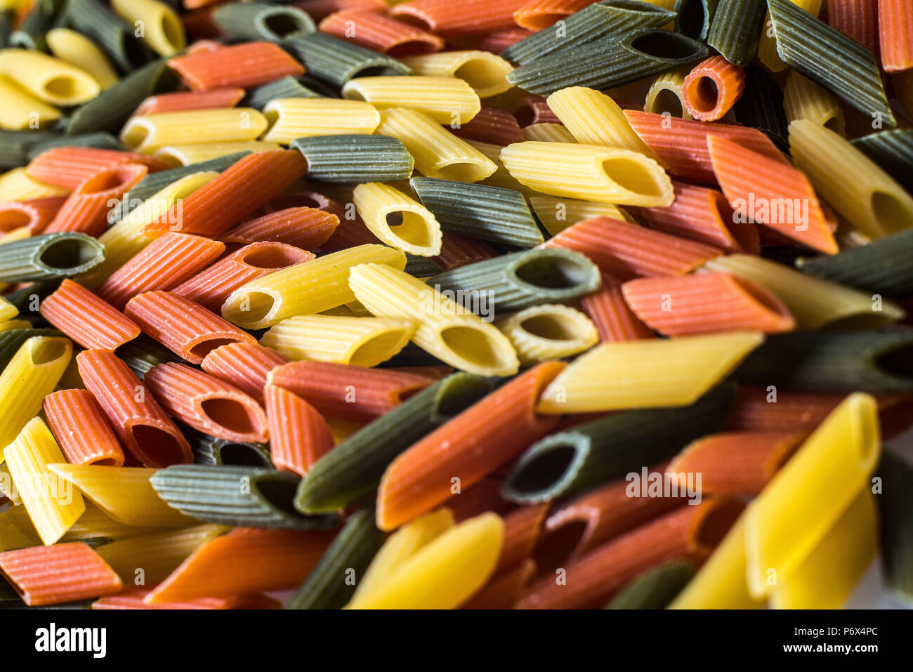 Macaroni tricolor with organic pasta integral Stock Photo - Alamy