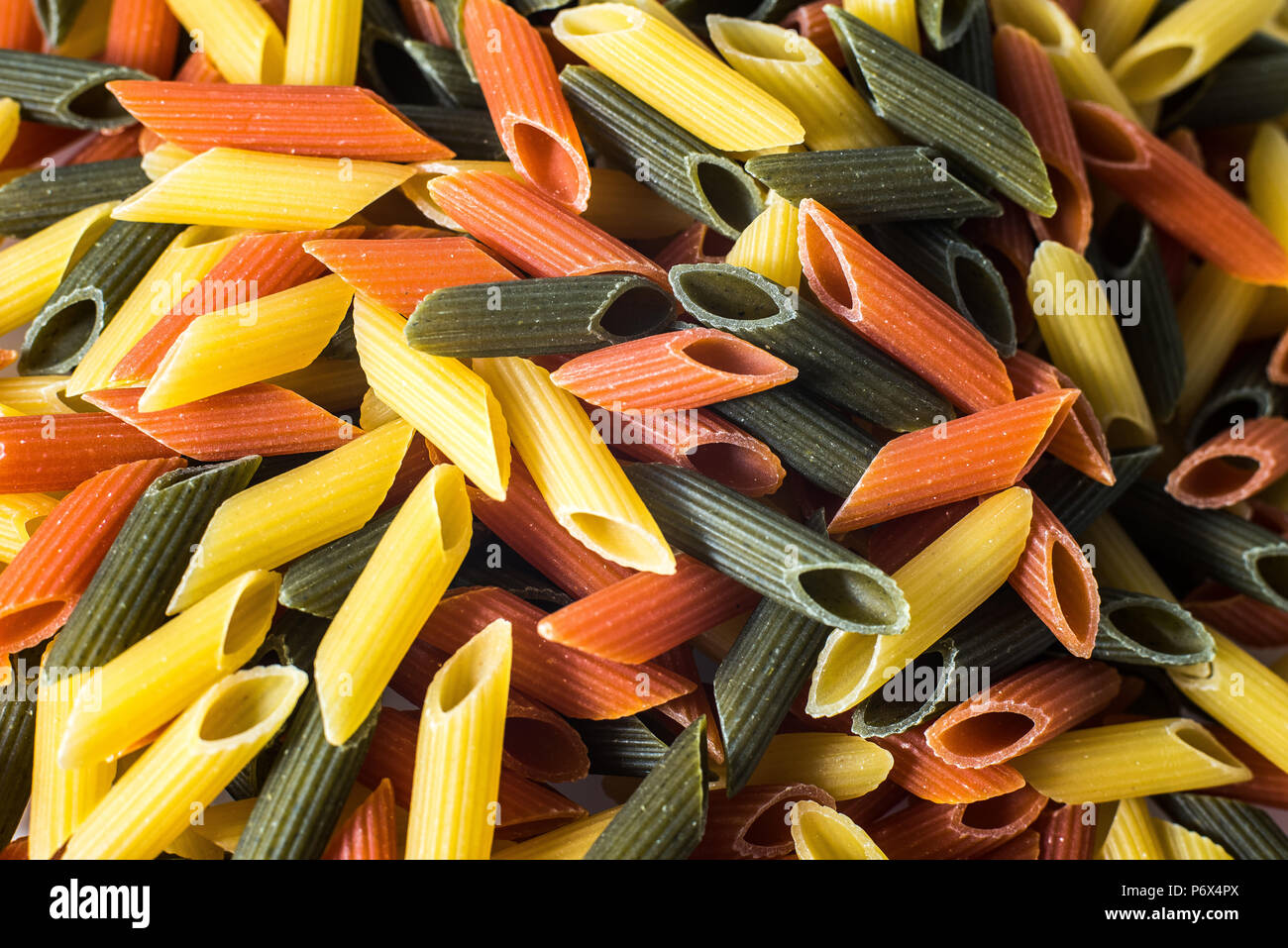 Macaroni tricolor with organic pasta integral Stock Photo - Alamy