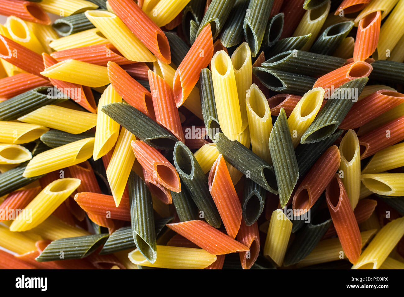 Macaroni tricolor with organic pasta integral Stock Photo - Alamy