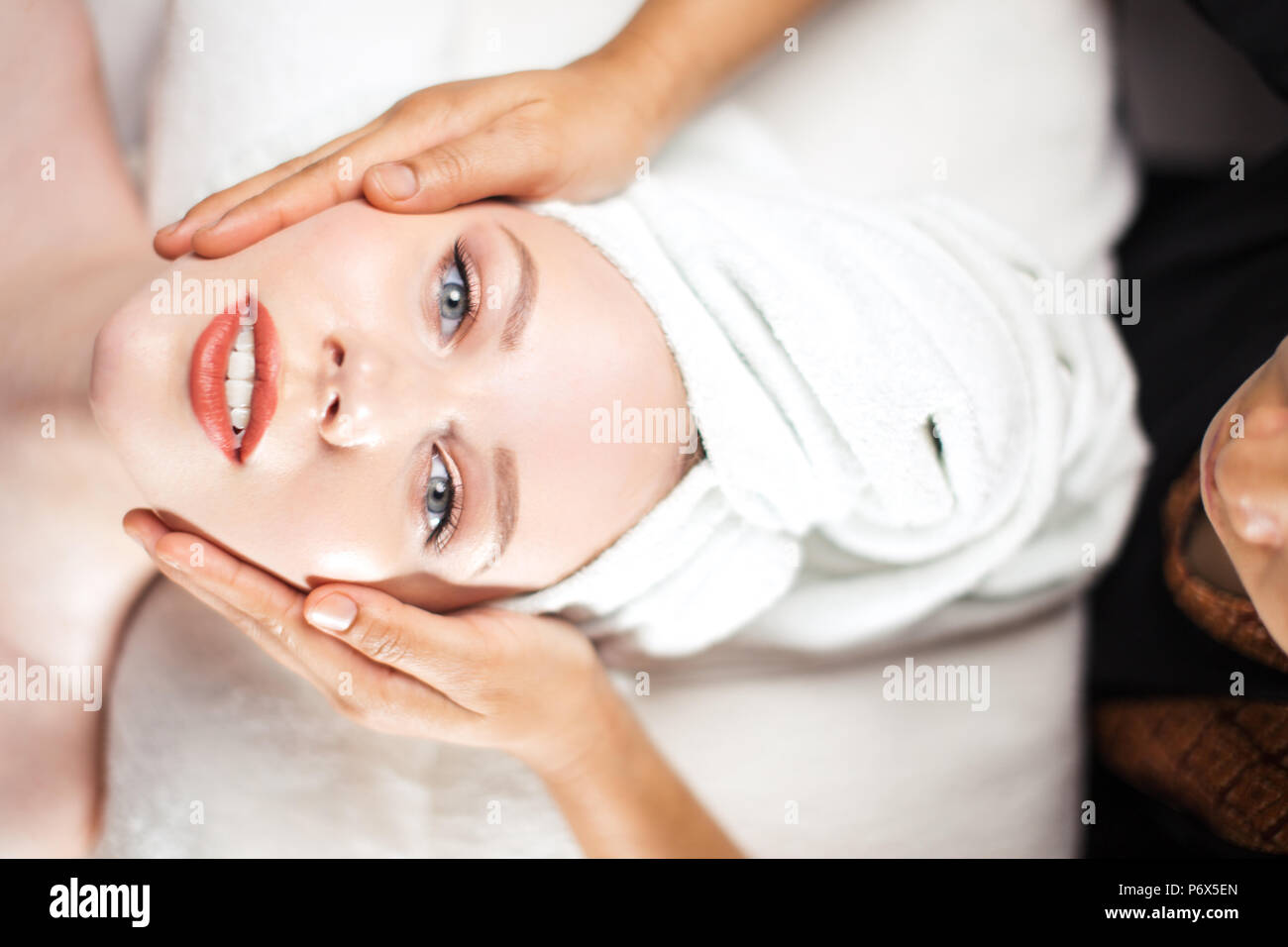 Top View Close Up Of Young Woman Getting Face Massage Treatment At Beauty Spa Salon Lying At