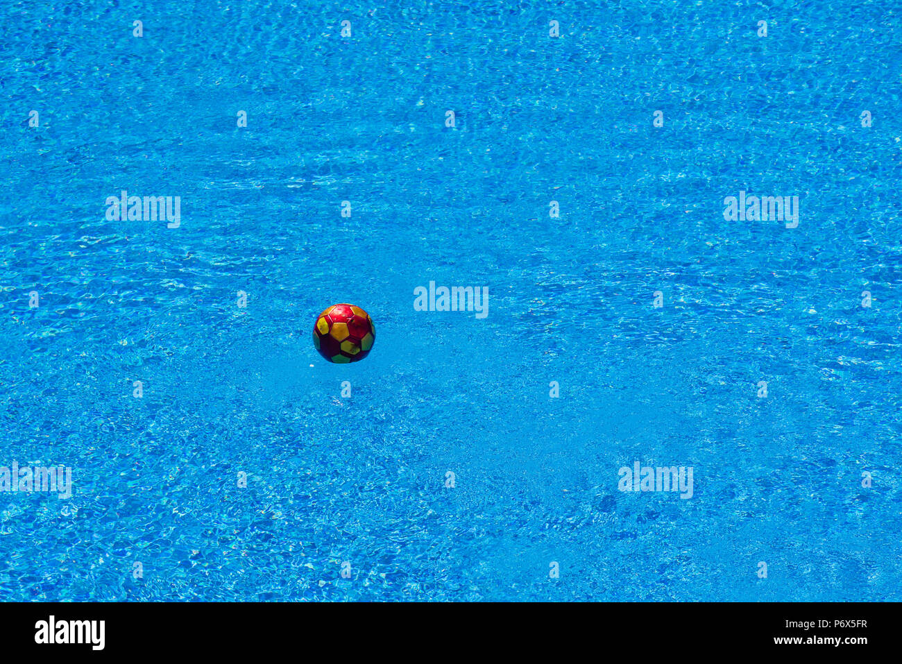 Soccer ball floating in a pool Stock Photo - Alamy