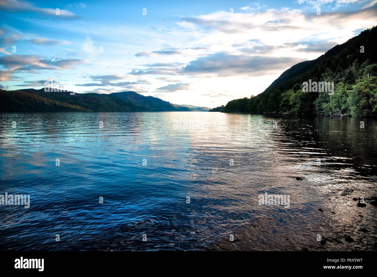 Blue lake among tranquil woods to relax with calm on vacation Stock ...