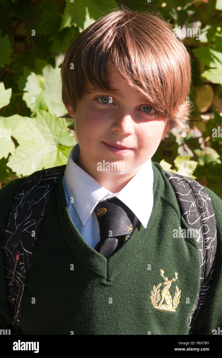 Portrait of schoolboy looking apprehensive, first day at senior school ...