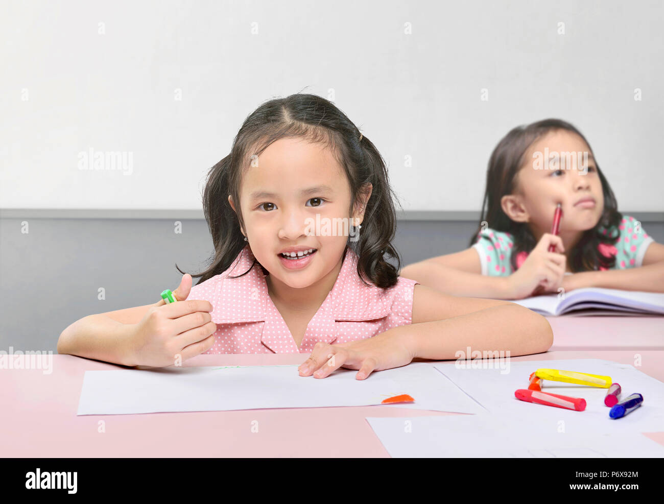 Cute asian kids learning on the classroom Stock Photo - Alamy