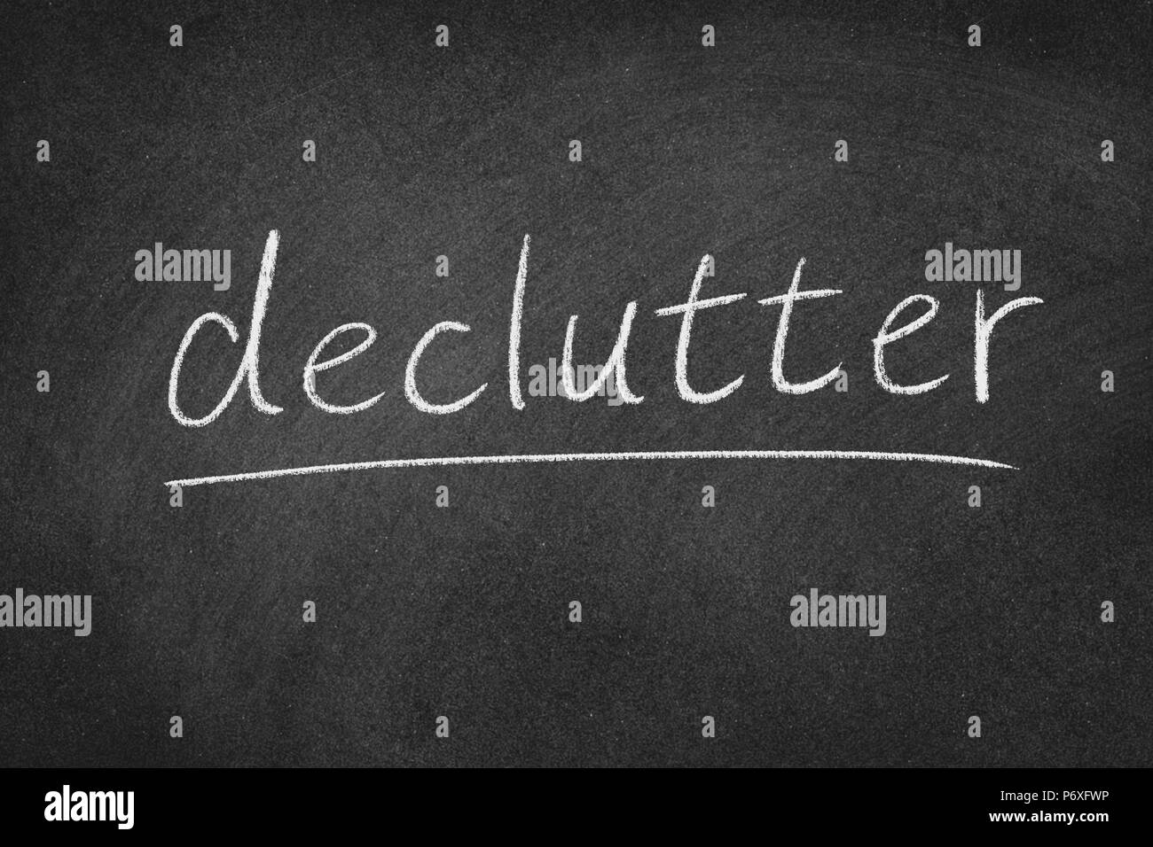 declutter concept word on a blackboard background Stock Photo - Alamy