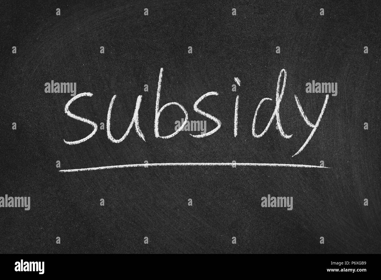 subsidy concept word on a blackboard background Stock Photo - Alamy