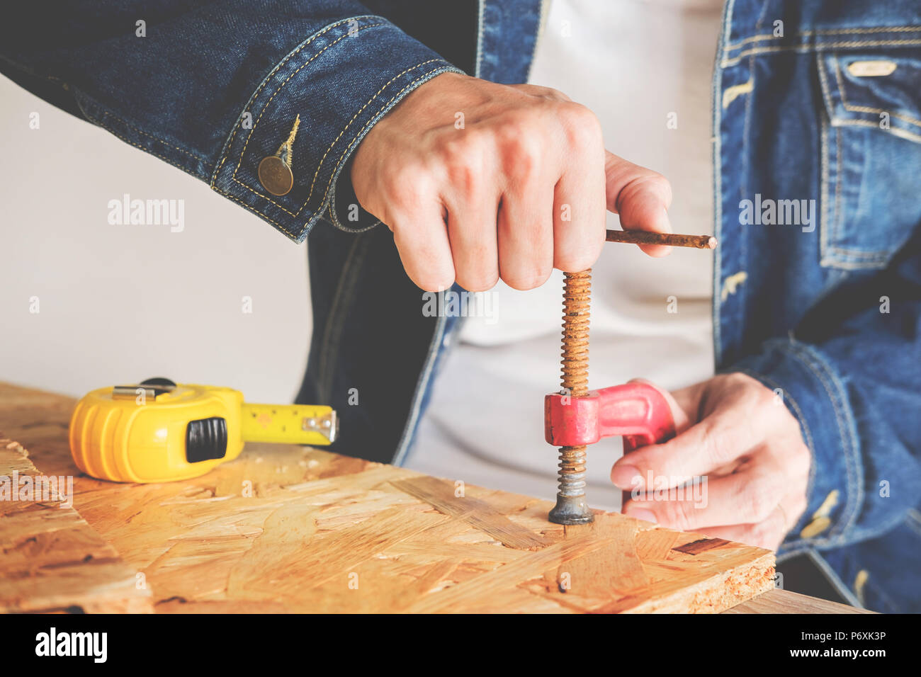 Carpenter working carefully looking at the plans work in carpentry. He ...
