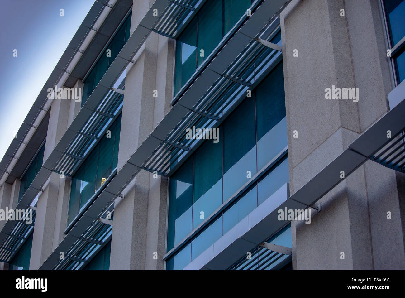 Angular composition of windows at twilight Stock Photo - Alamy