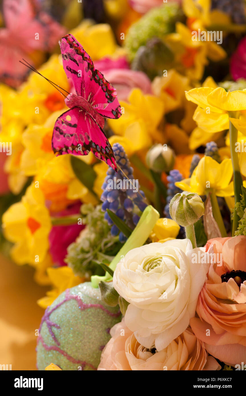 Beautiful spring flowers in a basket with Easter decorations Stock ...