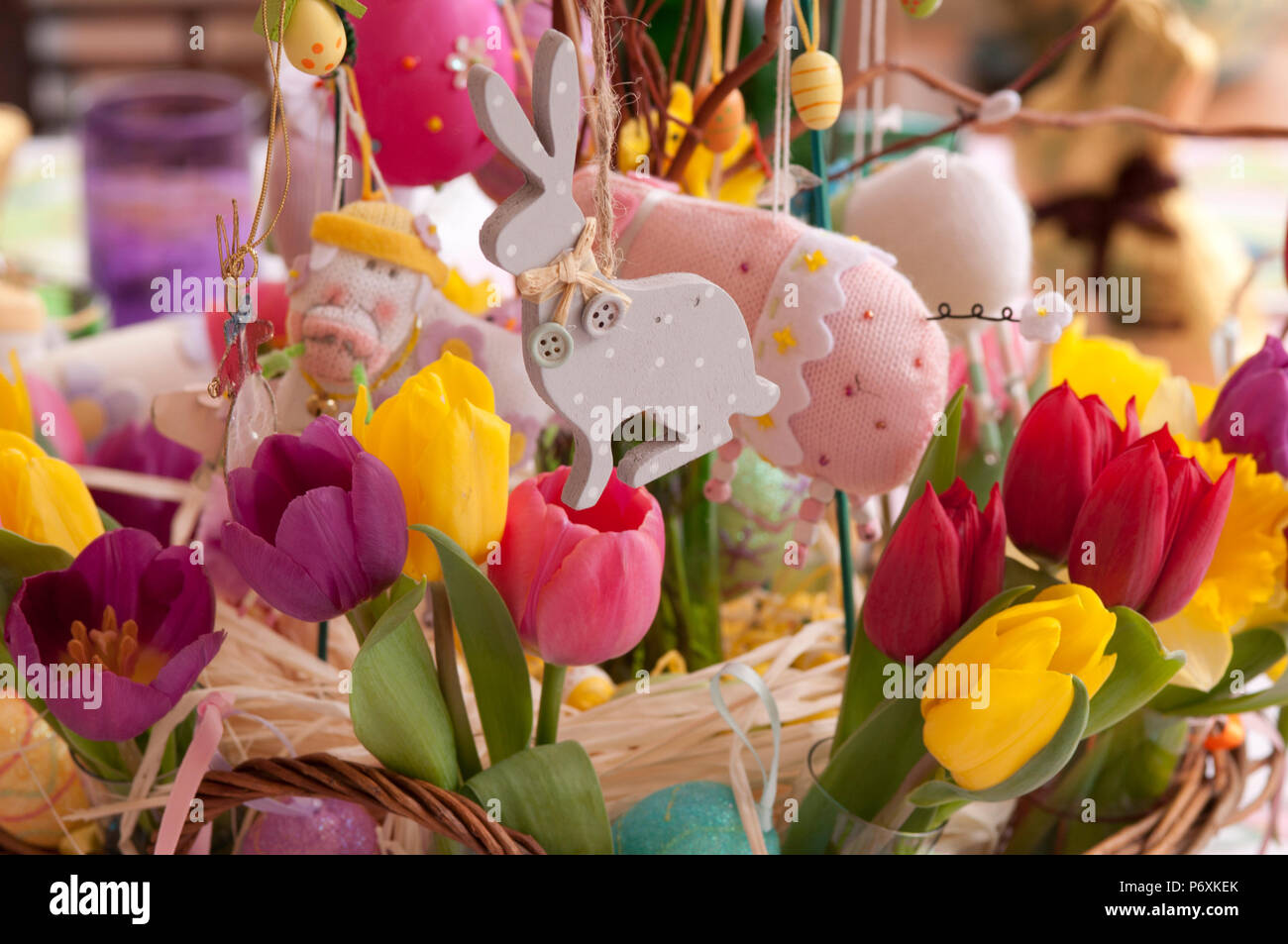 Beautiful spring flowers in a basket with Easter decorations Stock ...