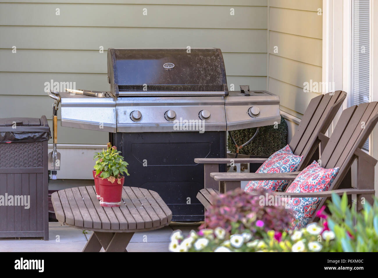 Beautiful BBQ area with seating and coffee table Stock Photo - Alamy
