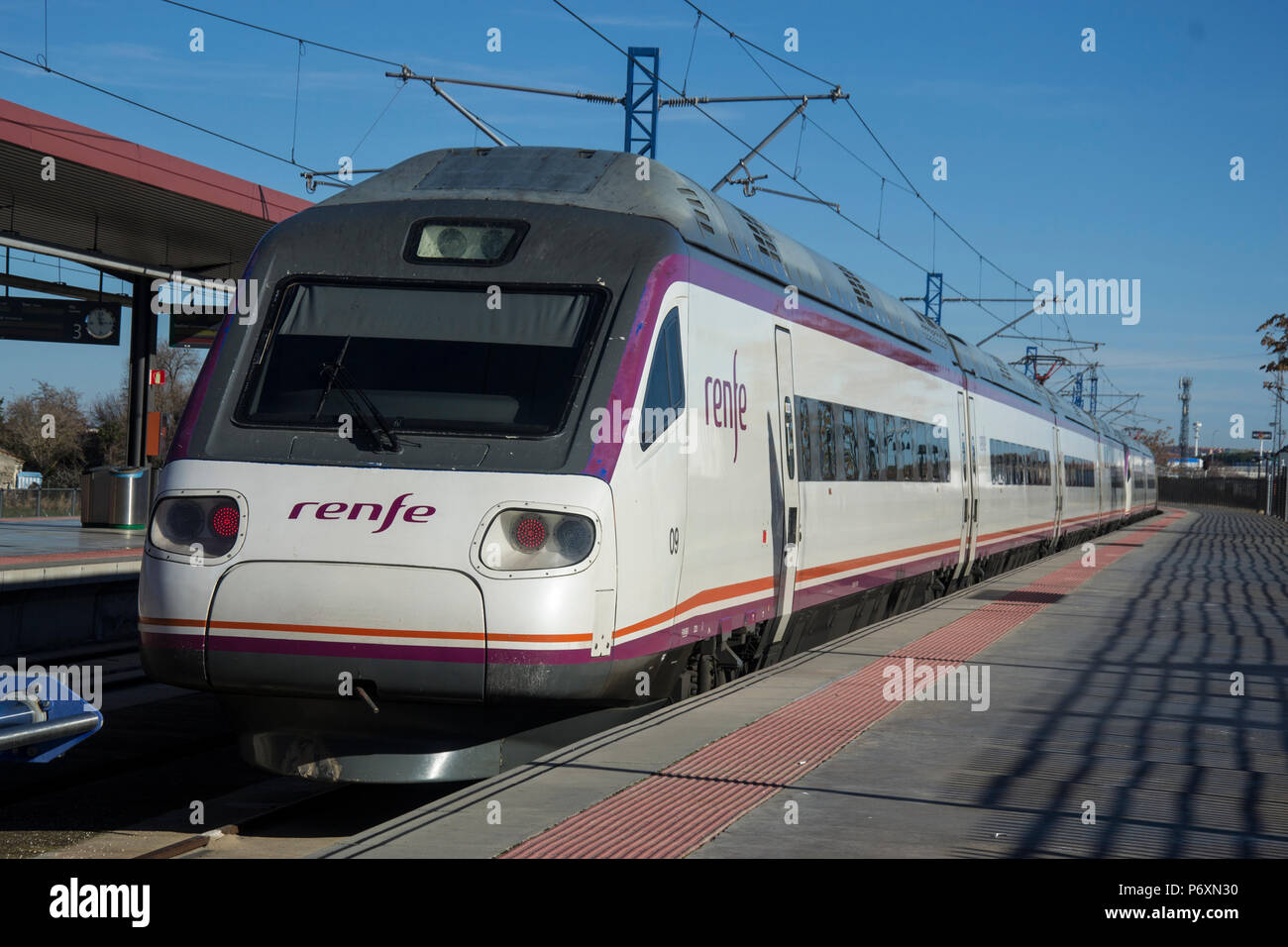 A high-speed train waits at the platform of the Spanish railway station ...