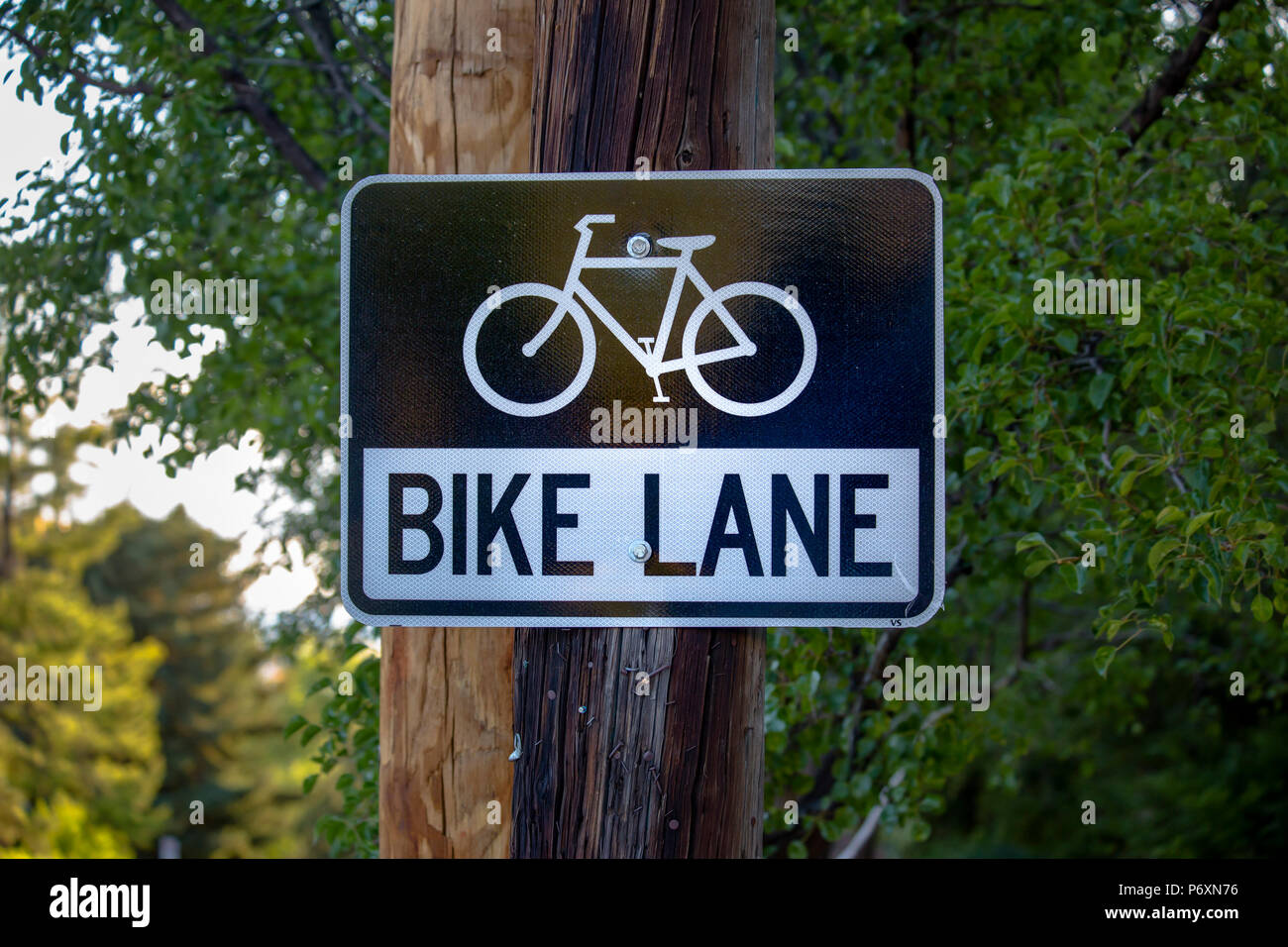 Bike lane sign in downtown Stock Photo - Alamy