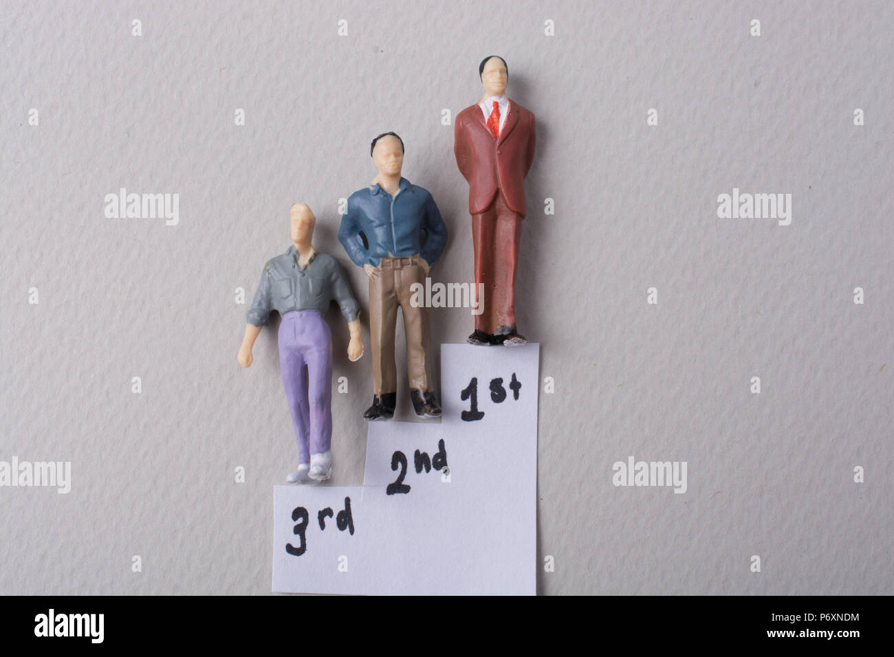 Tiny figurine of man miniature model in stages Stock Photo - Alamy