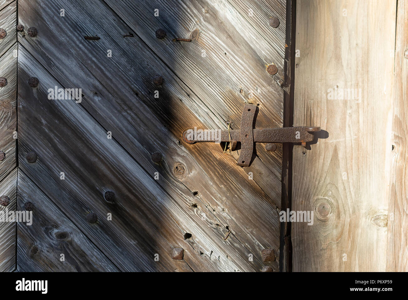 Ancient iron bolt on the wooden gate in the Ethnographic Museum of ...
