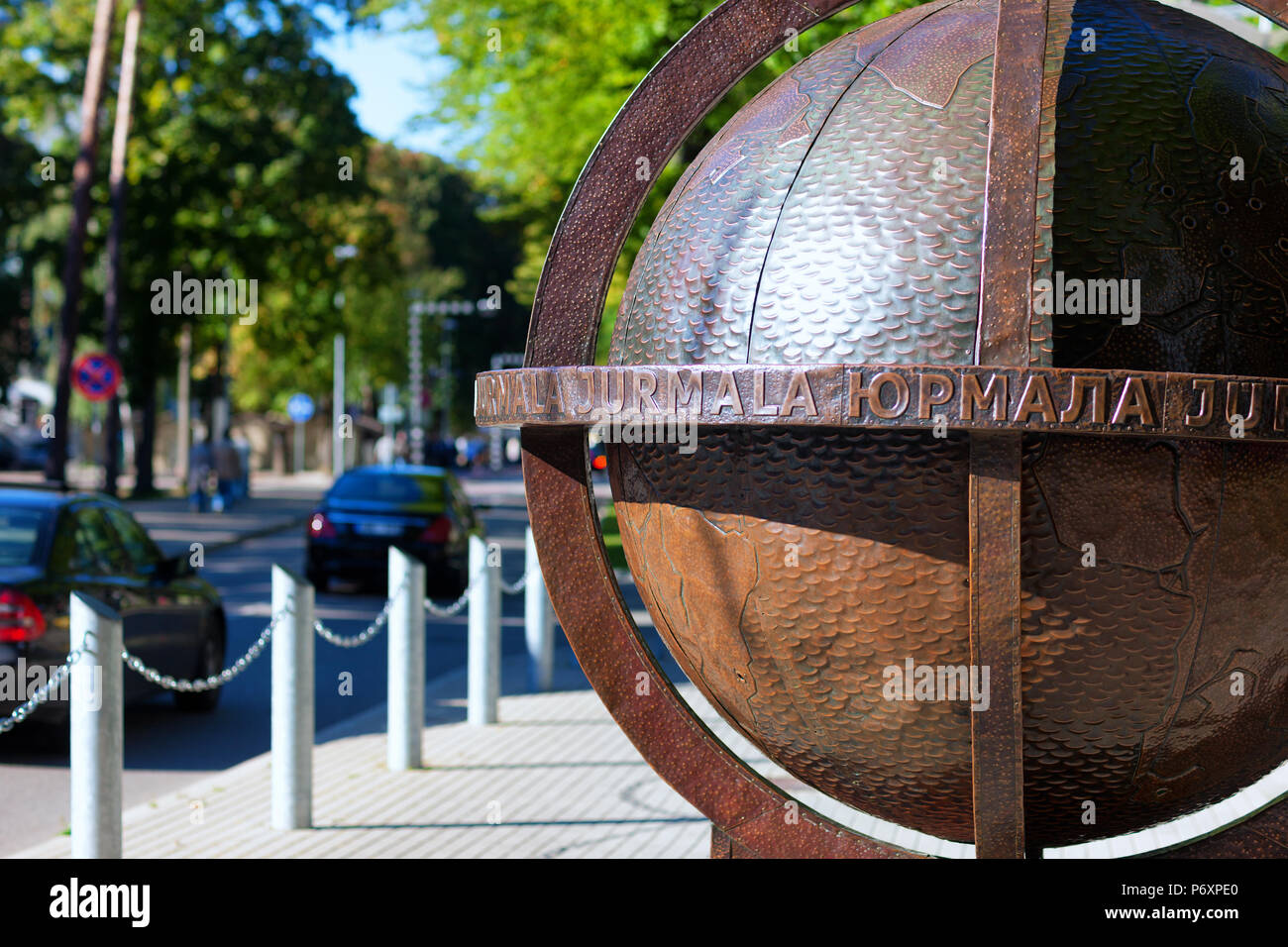 Copper globe on the street of the city of Jurmala on the Baltic Sea on ...