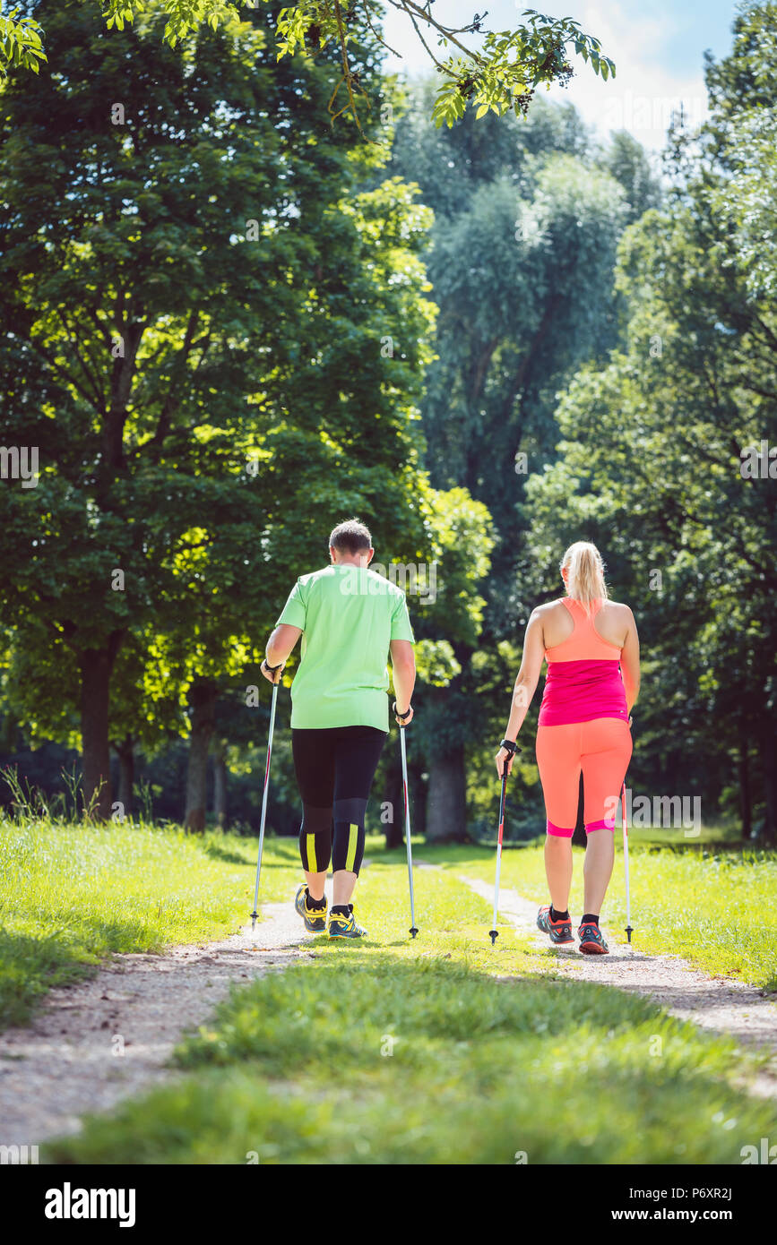 Couple doing Nordic Walking for sport Stock Photo - Alamy Couple doing Nordic Walking for sport Stock Photo - Alamy
