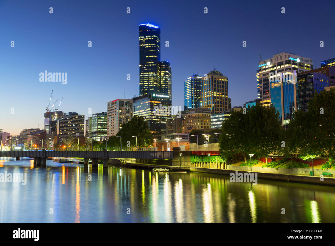 Rialto Towers and skyline along Yarra River at dusk, Melbourne ...