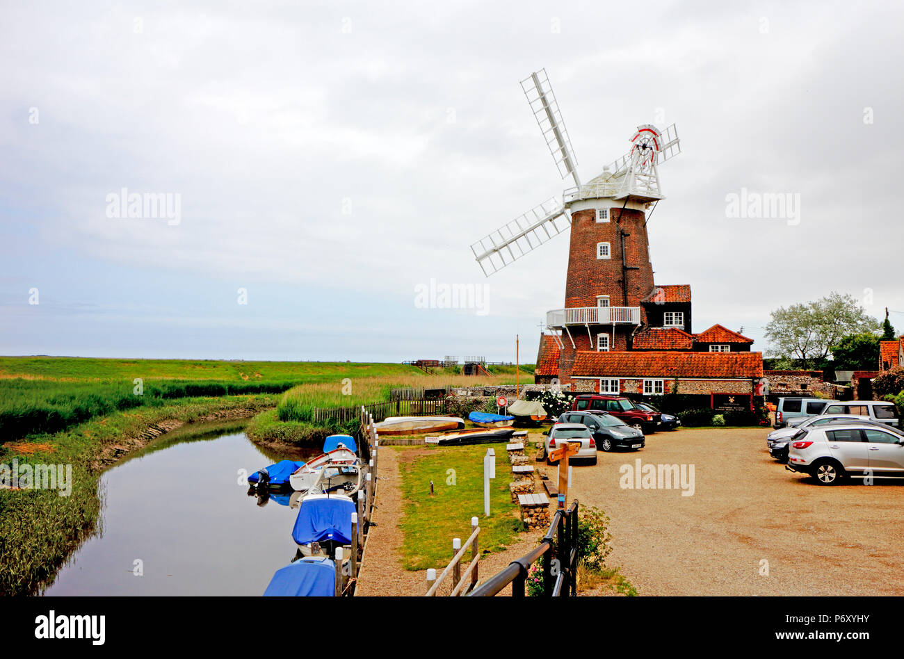 A view of the restored quay by the landmark windmill at Cley next the ...