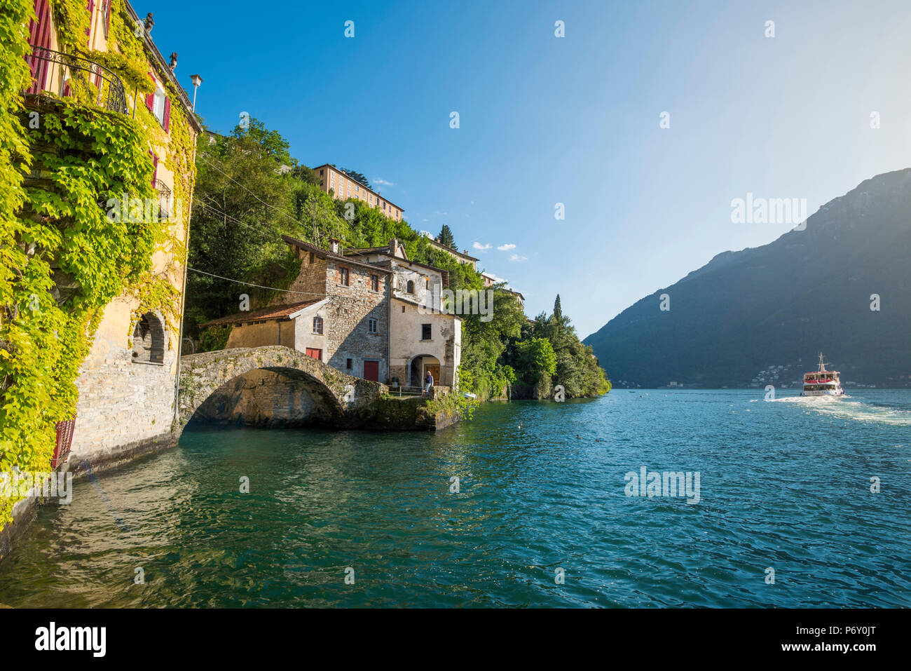 Nesso, lake Como, Como province, Italy. The roman stone bridge and a ...
