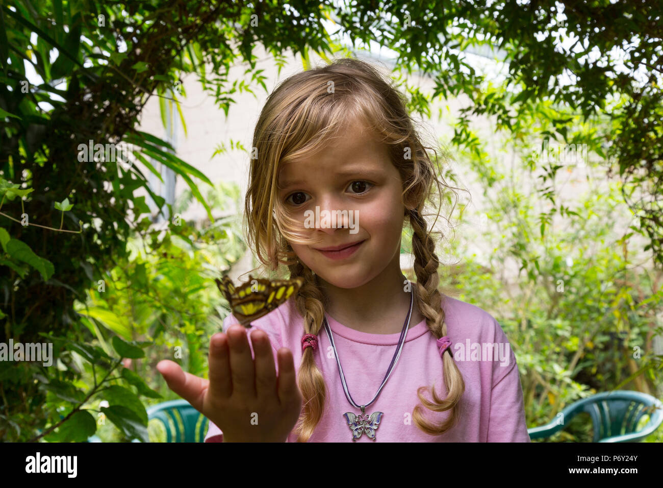Person with butterfly hi-res stock photography and images - Alamy