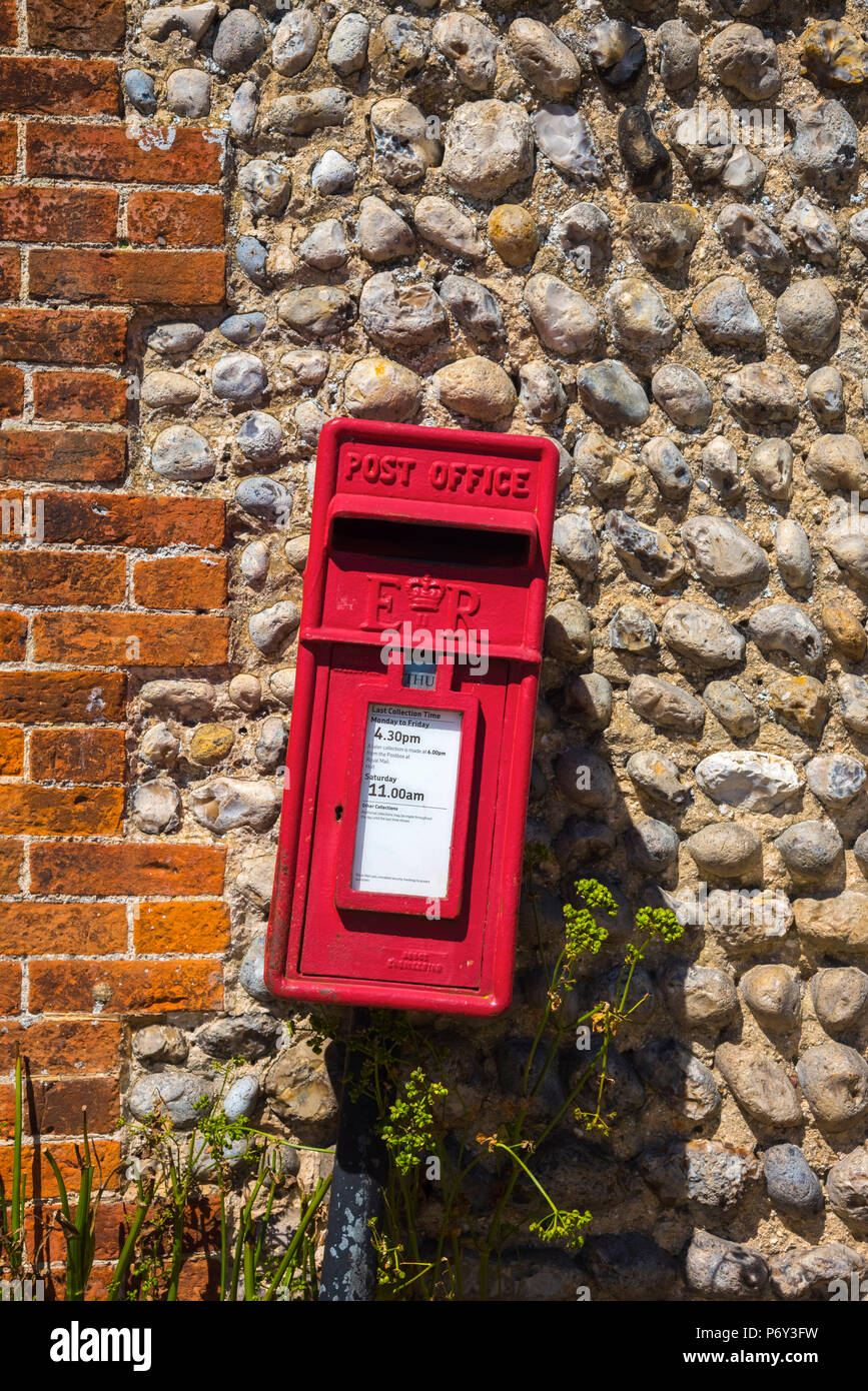 UK, England, Norfolk, North Norfolk, Blakeney, Red Post Box against ...