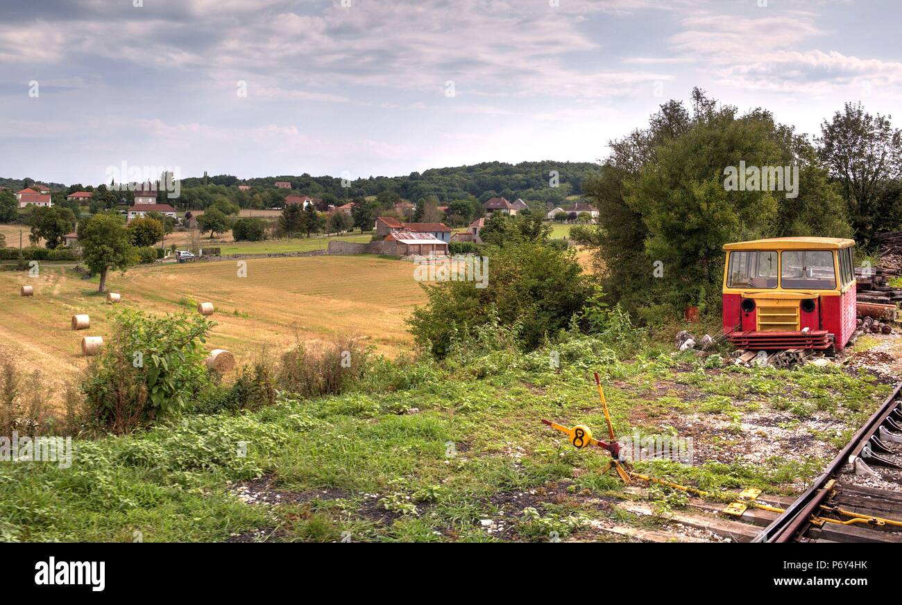 Old car next to train rails Stock Photo - Alamy
