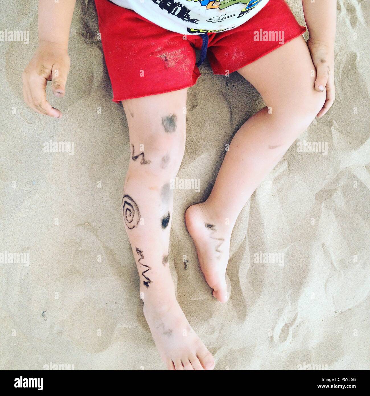 Feet and legs of children playing Stock Photo - Alamy