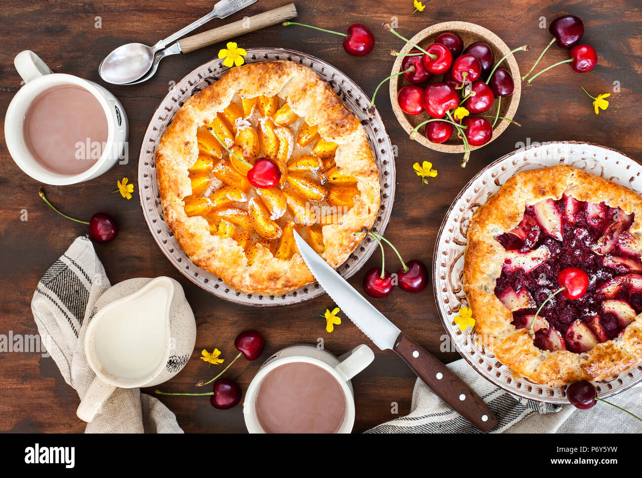 Rustic open pies with apricots and raspberry, top view Stock Photo - Alamy