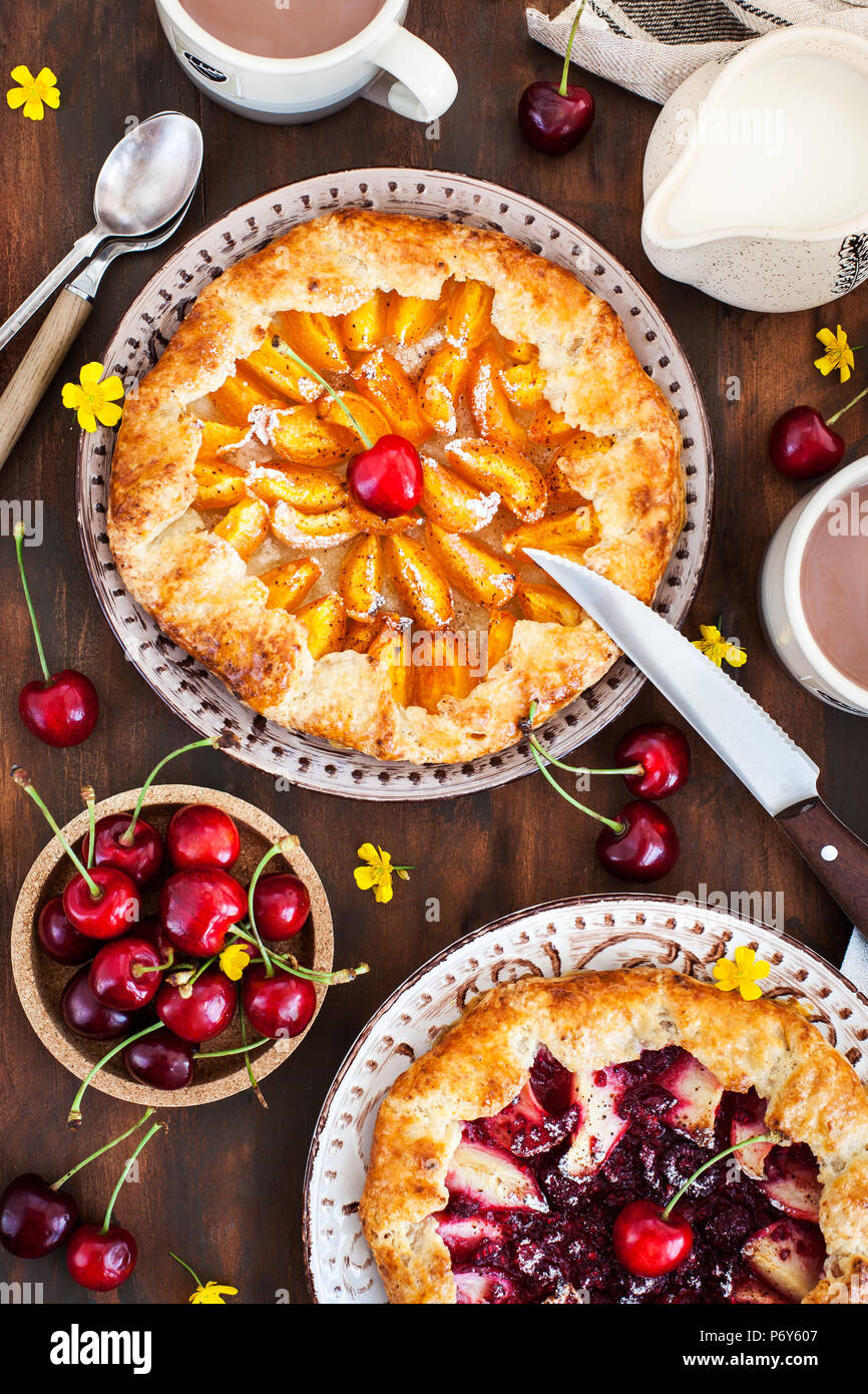 Rustic open pies with apricots and raspberry, top view Stock Photo - Alamy