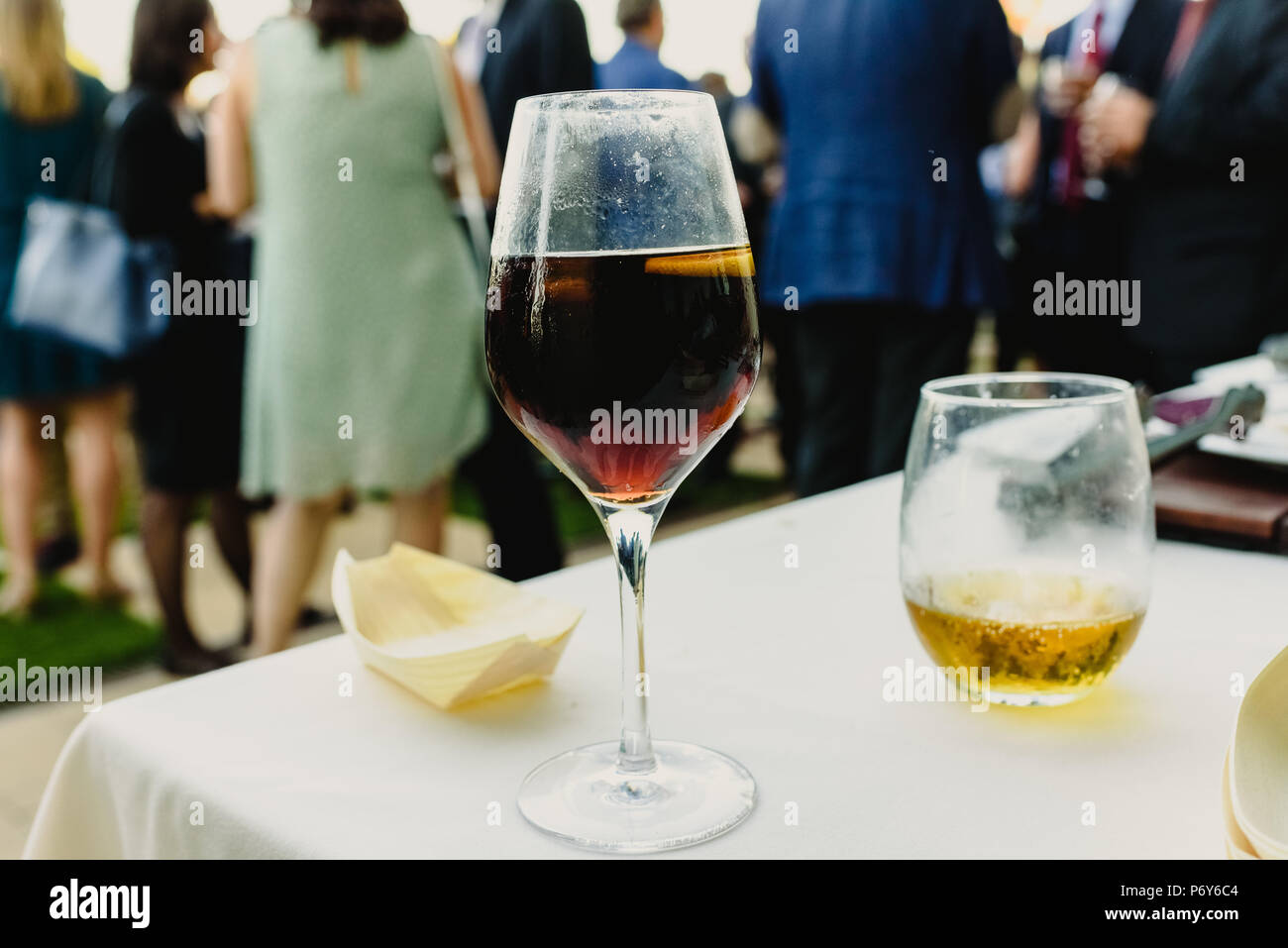 Guest drinks for a cocktail at a business event Stock Photo - Alamy