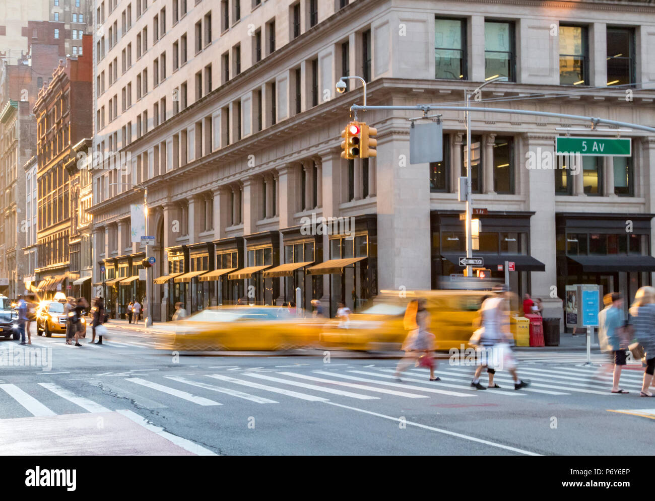 People and taxis in the intersection of Fifth Avenue and 23rd Street in ...