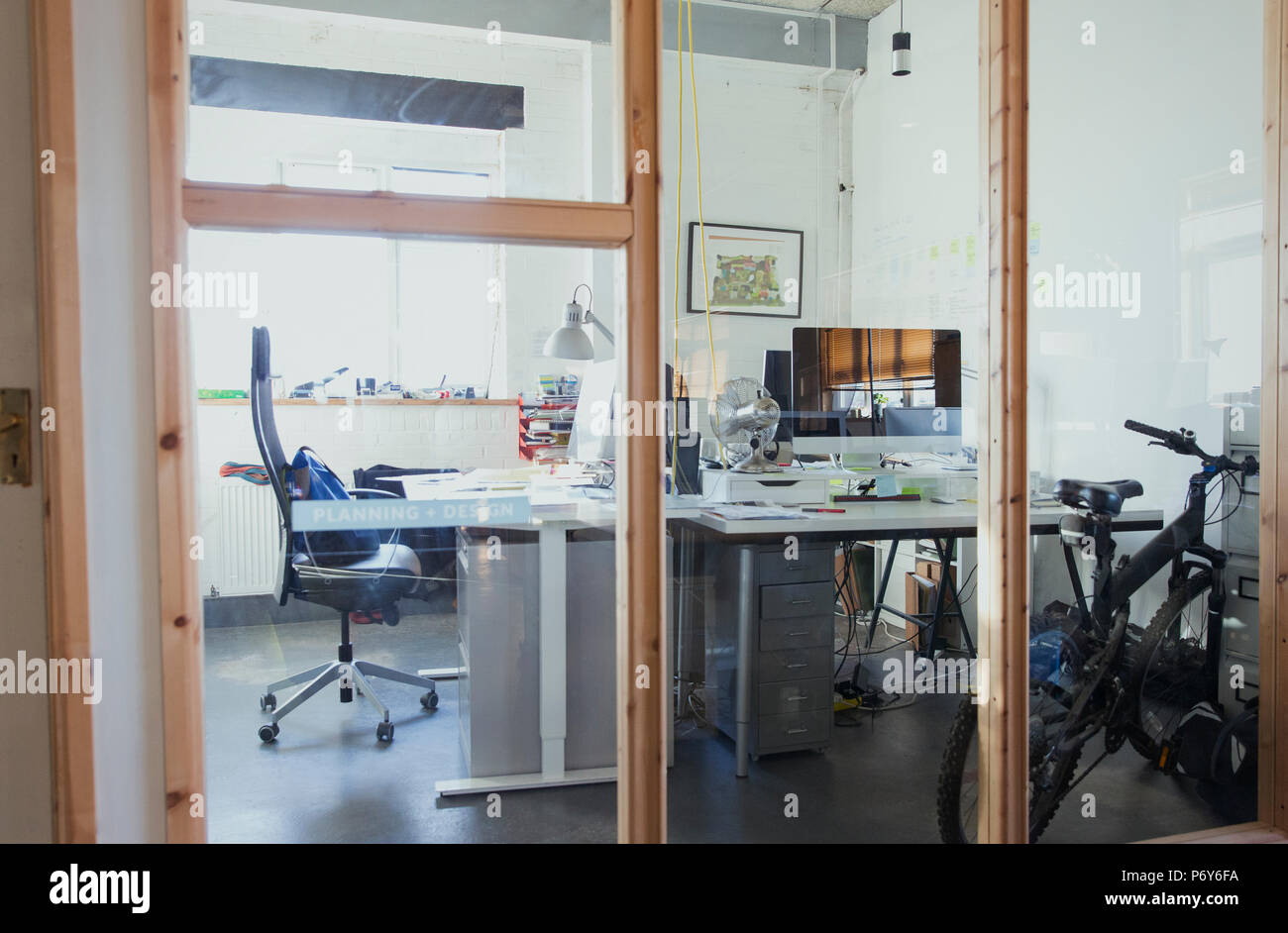 Office behind glass windows Stock Photo - Alamy