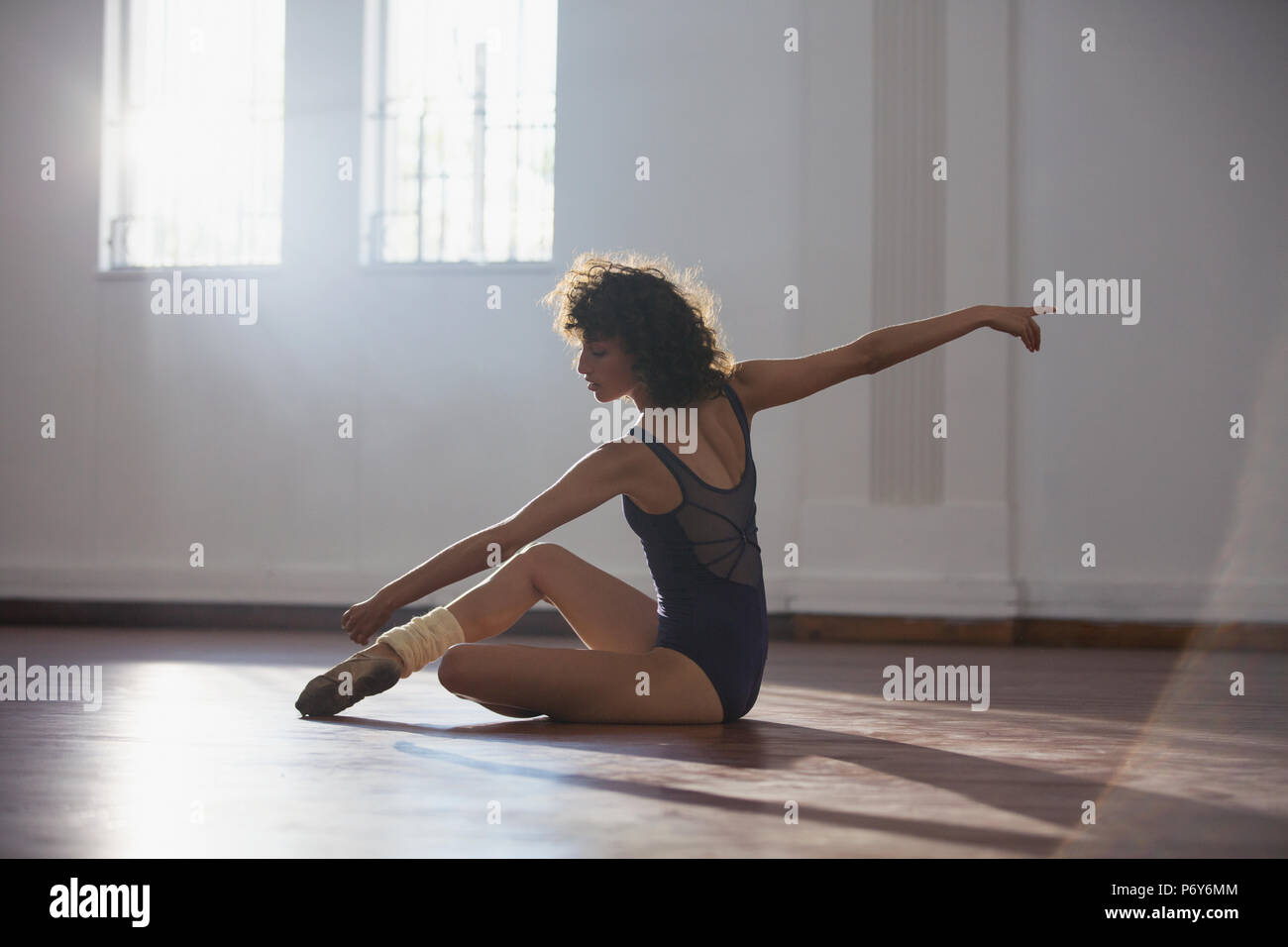 Female ballet dancer on one leg with arms outstretched hi-res stock ...