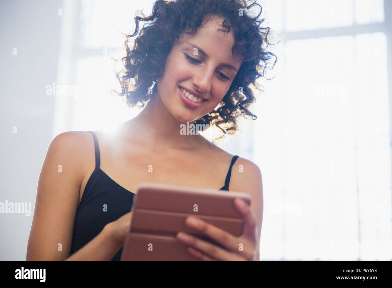 Young people using tablet hi-res stock photography and images - Alamy