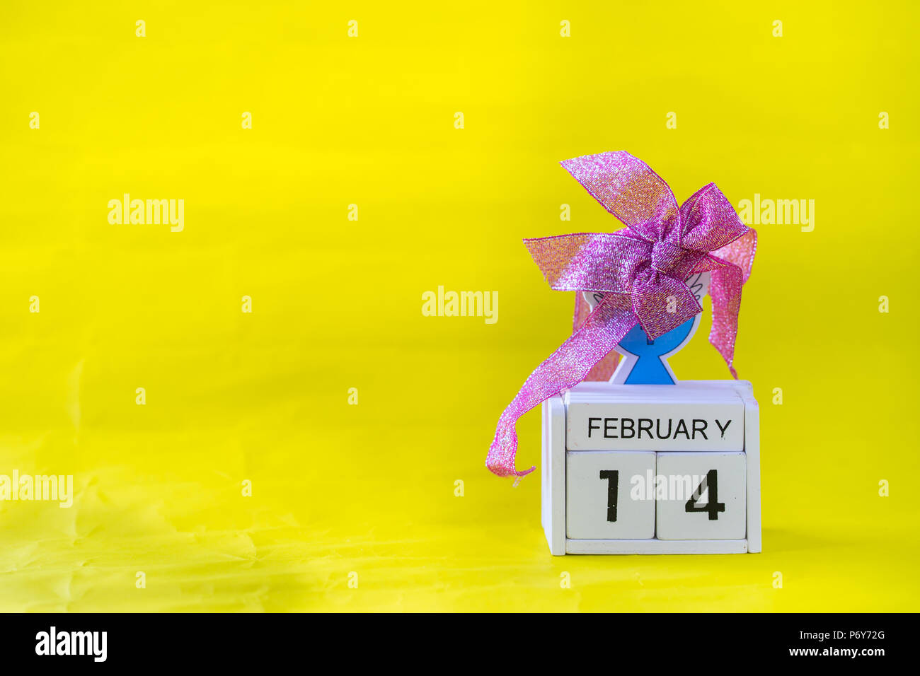 Alphabet 14 February box on yellow background Stock Photo - Alamy