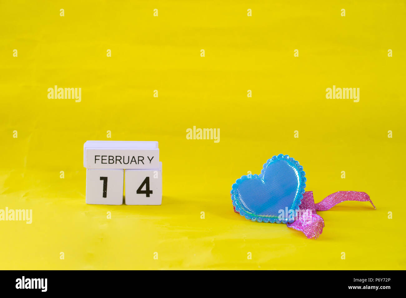 Alphabet 14 February box and blue heart on yellow background Stock ...