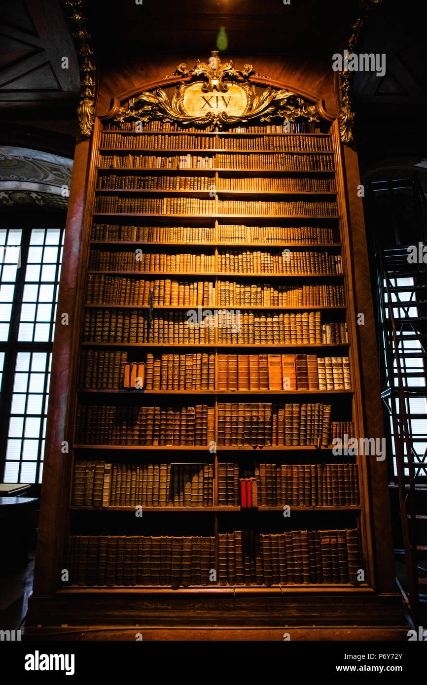Old library, little illuminated and gilded Stock Photo - Alamy