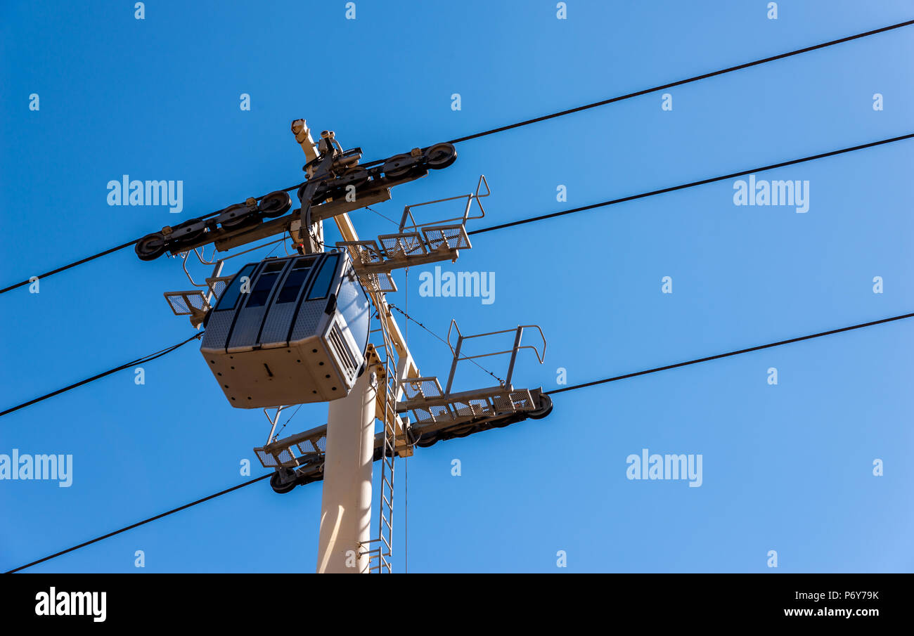 cableway against the sky, transport at height and tourist attraction ...