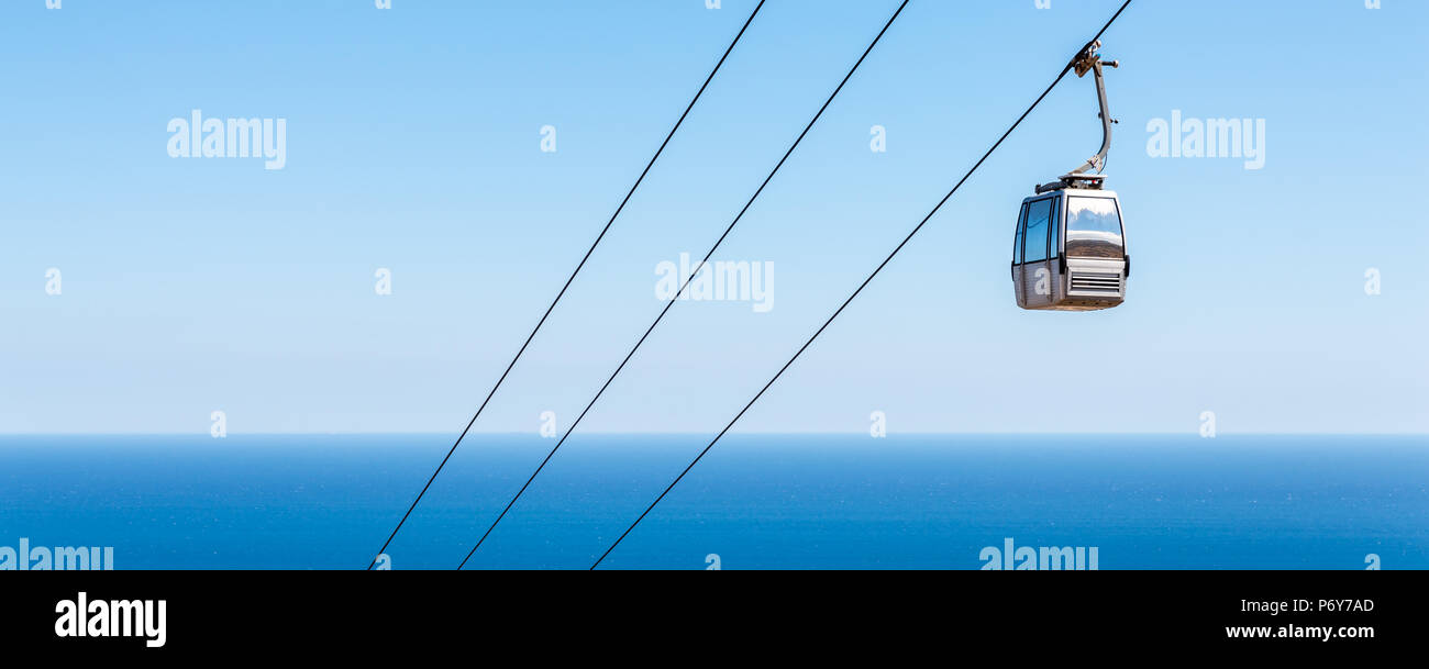 cableway against the sky, transport at height and tourist attraction ...