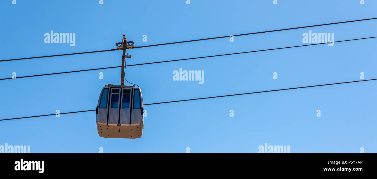 cableway against the sky, transport at height and tourist attraction ...