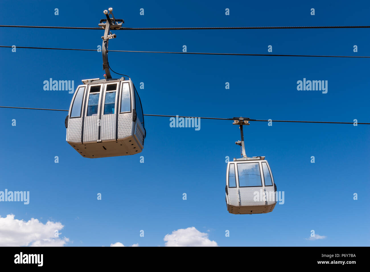 cableway against the sky, transport at height and tourist attraction ...