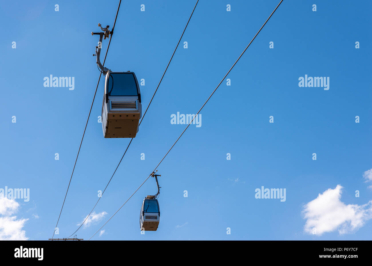 cableway against the sky, transport at height and tourist attraction ...