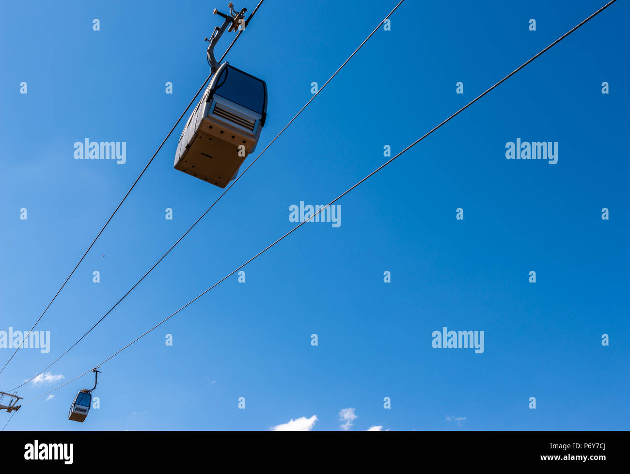 cableway against the sky, transport at height and tourist attraction ...