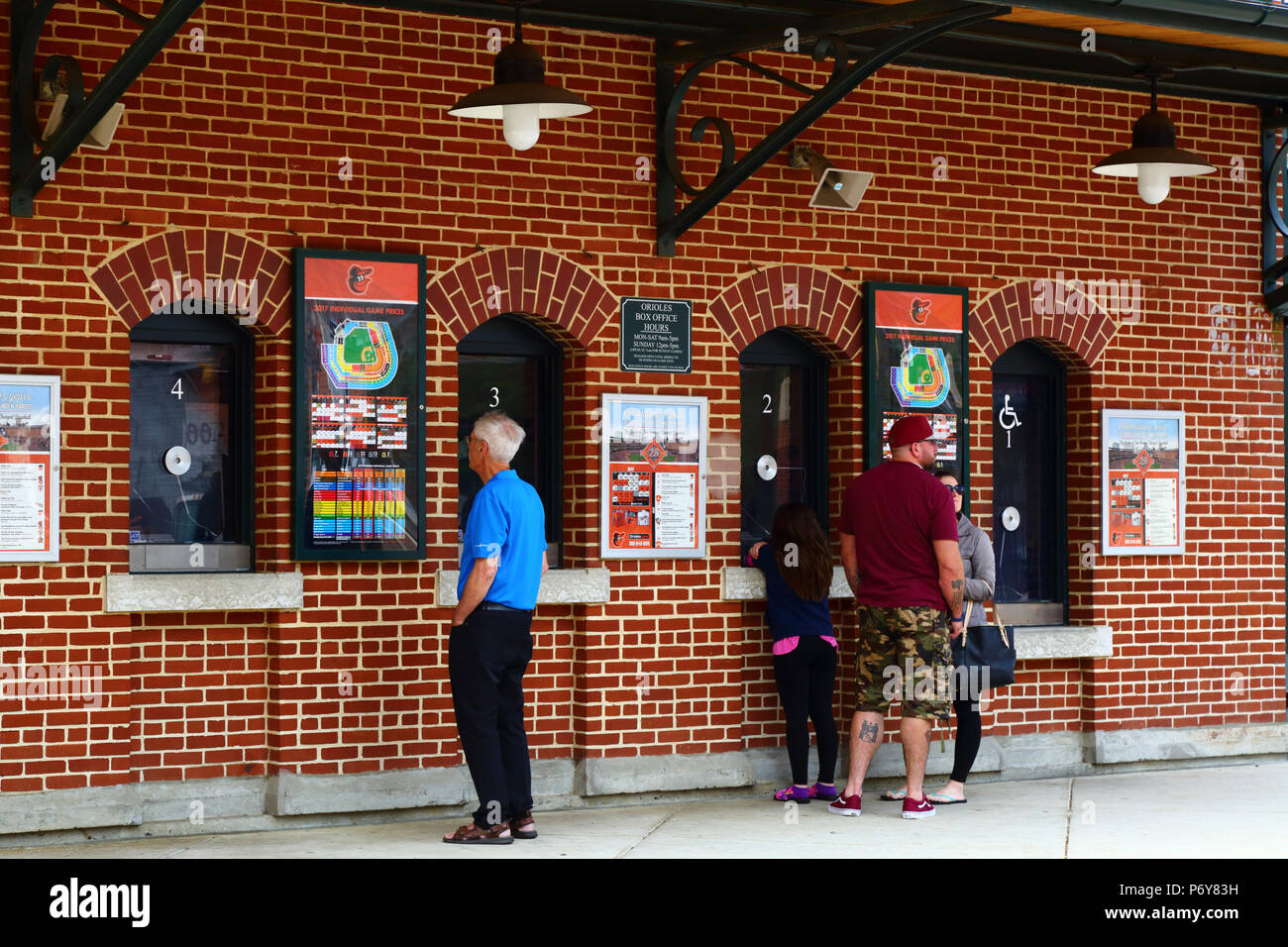 People at ticket office windows at Oriole Park, Camden Yards, Baltimore ...