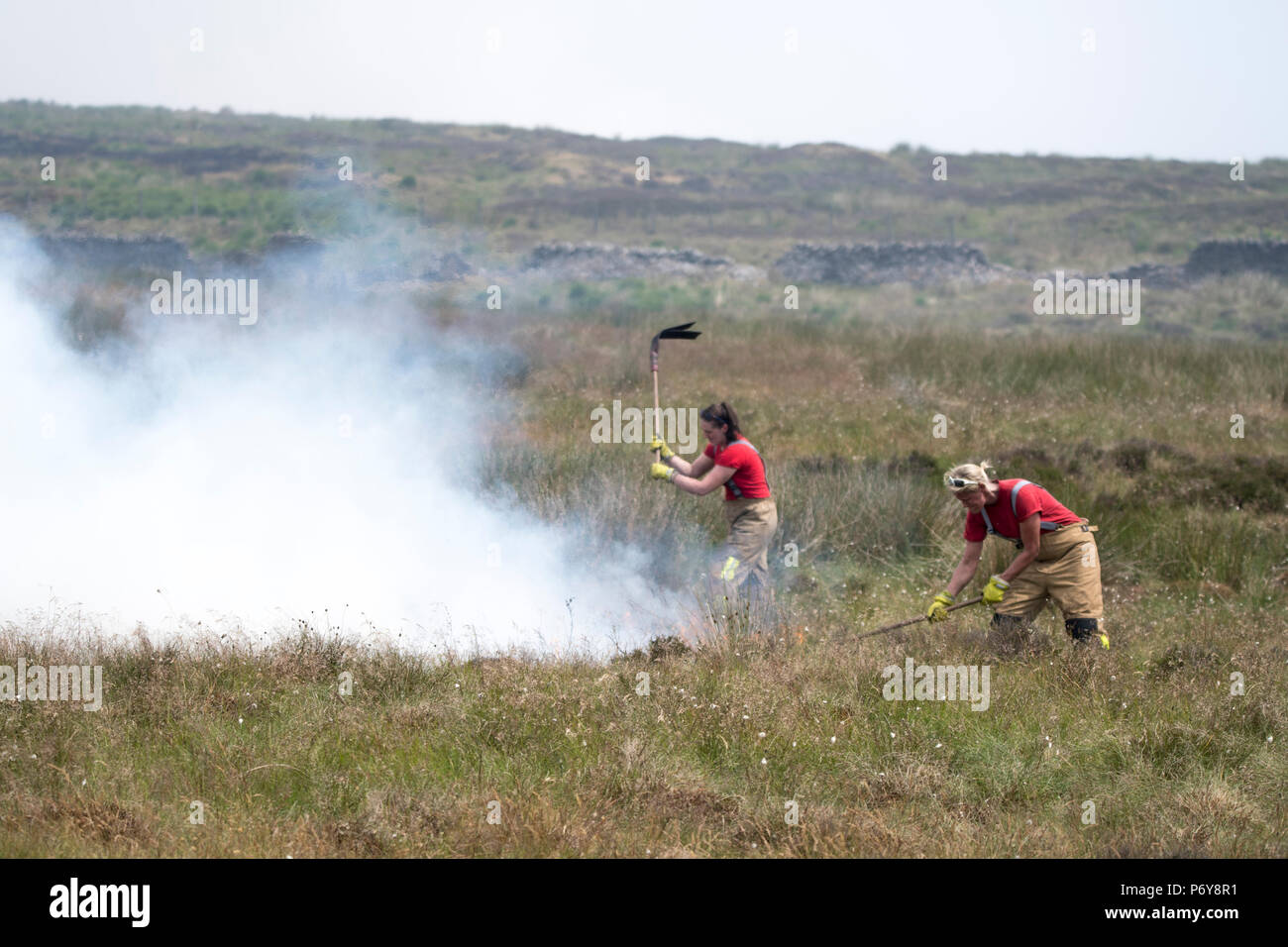 1 July 2018 - Female firefighters use whackers to battle the Winter ...
