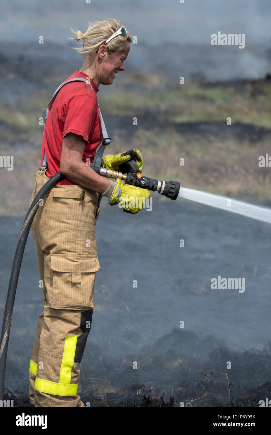Female firefighter uk hose hi-res stock photography and images - Alamy