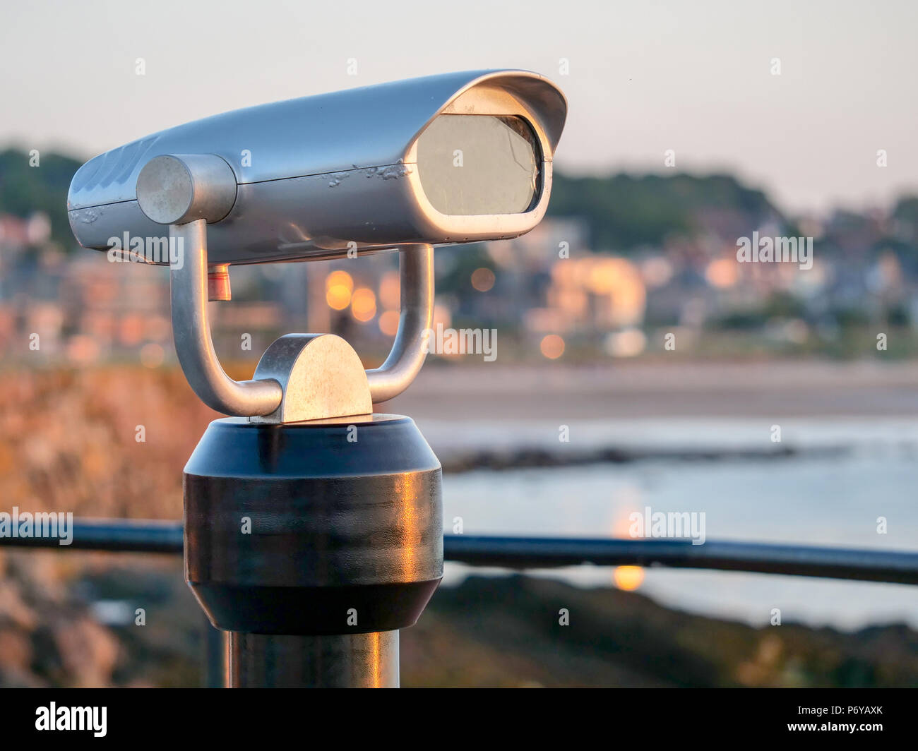 A beach telescope at sunset, North Berwick Harbour, East Lothian ...