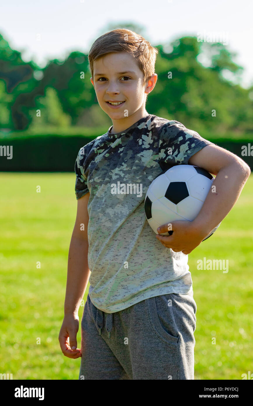Teen play football park hi-res stock photography and images - Alamy